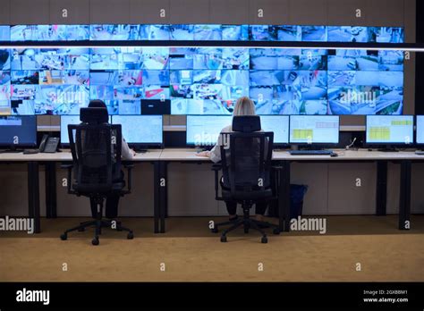Group Of Security Data Center Operators Working In A Cctv Monitoring