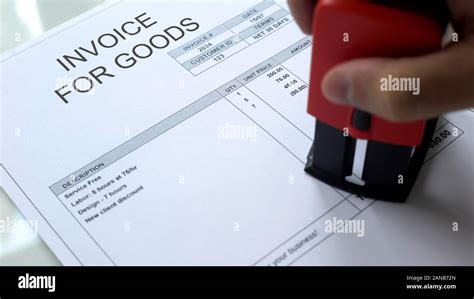 Hand Stamping Rectangular Seal On Invoice For Goods Commercial Document