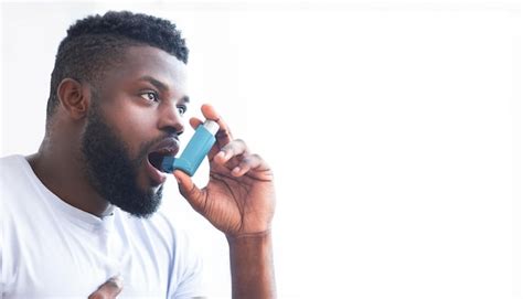 Premium Photo Man Using An Inhaler To Treat Asthma
