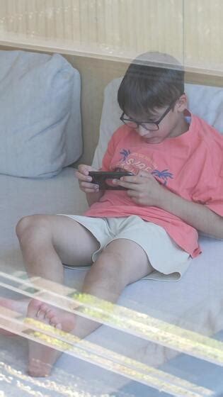 Vertical Boy Playing Games Inside Modern Tiny House 49691958 Stock