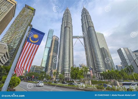 The Malaysia Flag Is Also Known As Jalur Gemilang Waving With A City In