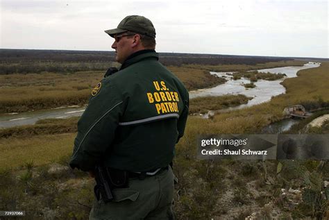 Eagle Pass Border Patrol Look Over The Rio Grande Scanning The Area