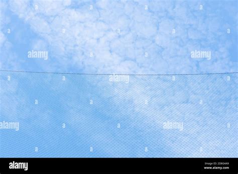 Net Mesh Grid And Blue Sky Background Stock Photo Alamy