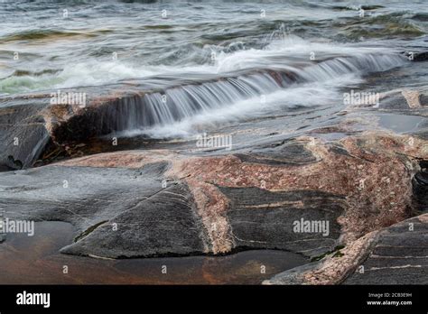 Wave Action On Shoreline Granite Outcrops Along Lake Superior At