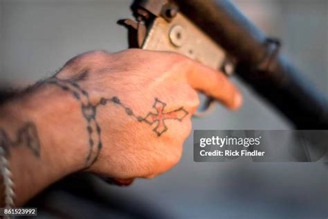 Cross Hand Tattoo Photos And Premium High Res Pictures Getty Images
