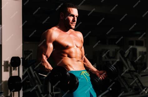 Premium Photo Biceps Dumbbells Exercises Bodybuilder In Gym Training