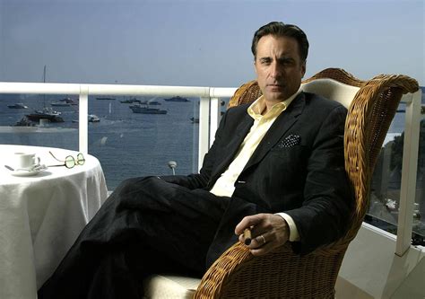 Download Andy Garcia Intensely Cherishing A Cuban Cigar Wallpaper