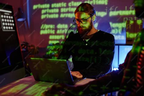 Premium Photo Serious Bearded Software Developer Looking At Data On