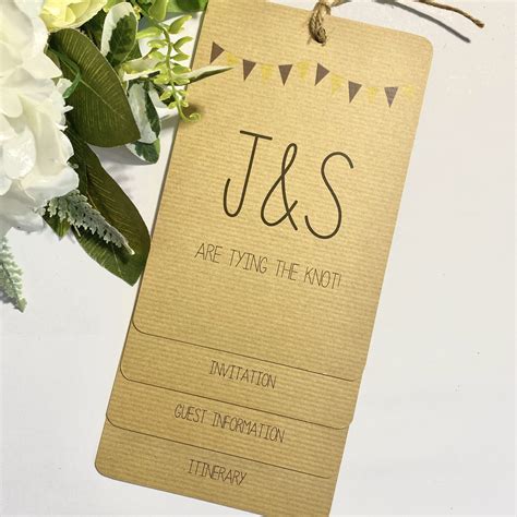 Rustic Loop Tied Wedding Invitations With Twine And Bunting Detail