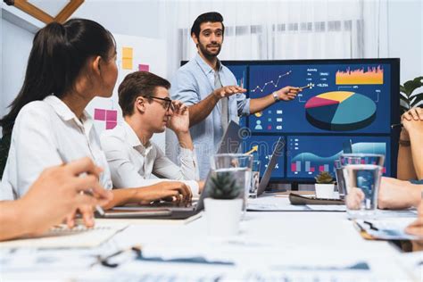 Analyst Team Utilizing Bi Fintech To Analyze Financial Data At Table