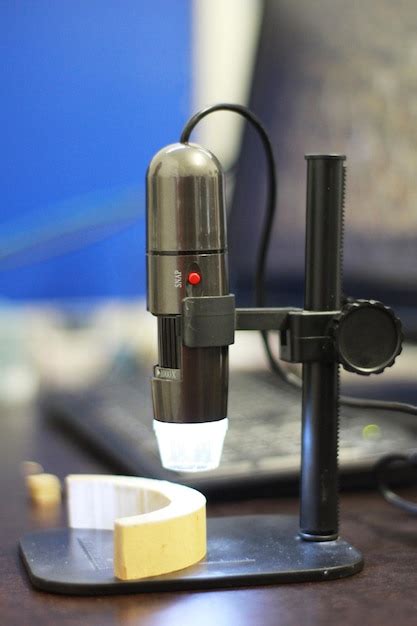 A Lamp With A Red Button Premium Photo