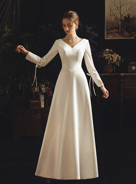 A Line White Satin V Neck Long Sleeve Backless Wedding Dress With Bow
