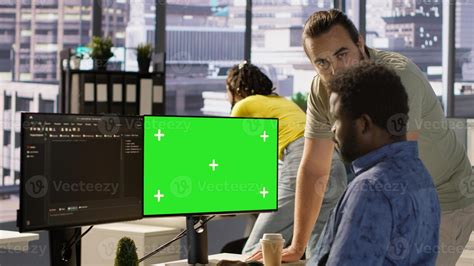 admin doing software debugging on green screen pc asking for help from
