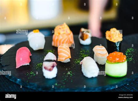 Maki And Nigiri Sushi Variety With Salmon Shrimp Avocado And Tuna At A Sushi Restaurant Stock