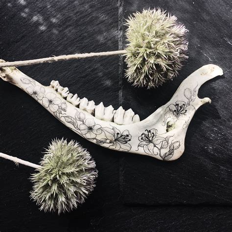 Animal Teeth Decorated With Flowers And Leaves
