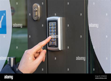 Secure Home System Hand Pressing On Intercom Keypad Using Door Phone