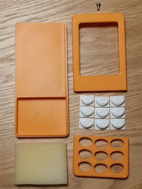 A Toy Phone With Pushable Buttons And Instax Mini Photo As A Screen R