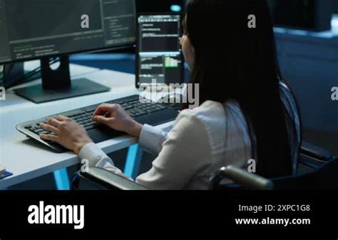 Person With Paraplegia Working In Inclusive Server Hub Workspace Typing On Pc Woman In