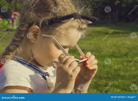 The Girl Puts On Sunglasses Stock Image Image Of White Holds 291107247