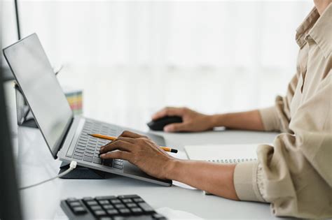 Developer Programmer Using Mouse And Typing Code On Laptop While