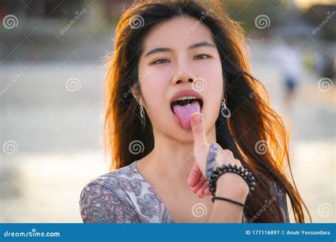 Naughty Chinese Girl Is Licking Her Finger For Sensuality Concept Stock