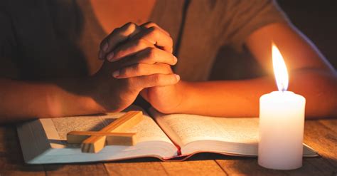 Praying With A White Candle In The Bible At Christy Redfield Blog