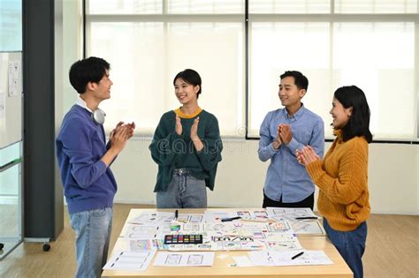 Team Of Creative People Brainstorming And Discussing For Mobile