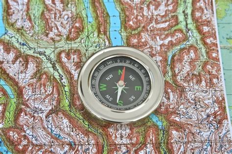 premium photo orienteering using a map and compass