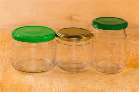 Different Colored Lids For Glass Jars Bottom Side View Stock Image