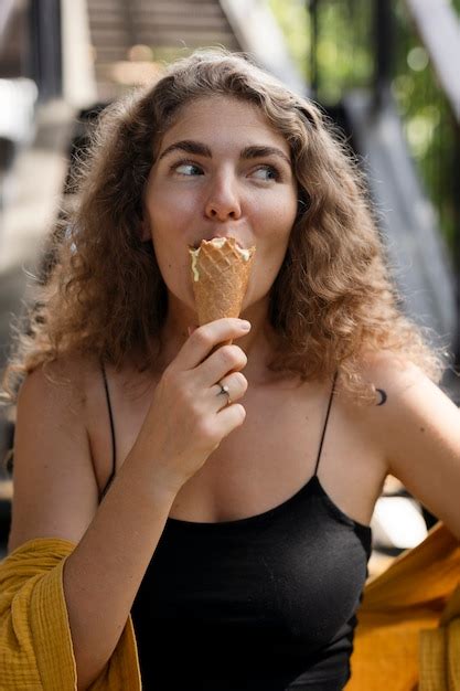 Premium Photo Front View Woman Licking Ice Cream Cone