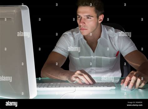Handsome Focused Computer Engineer Working At Night Stock Photo Alamy