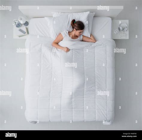 Beautiful Young Woman Lying Down In Bed And Sleeping Top View Stock