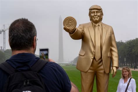12 Foot Golden Donald Trump Statue Holding Bitcoin Unveiled In Capitol