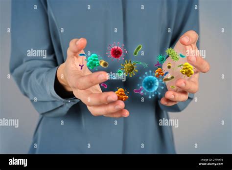 Man Showing Hands With Microbes On Grey Background Closeup