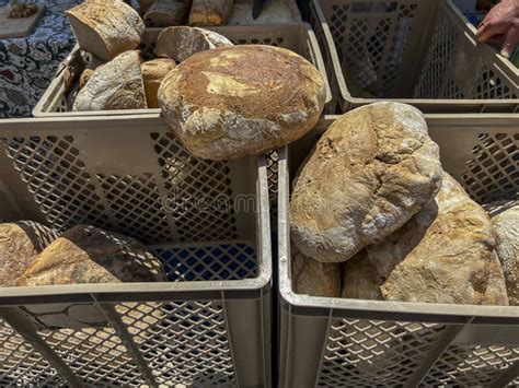 Loaves Of Bread Lying In Plastic Crates Ready To Be Cut Tasted And