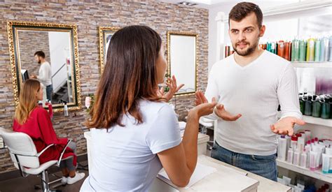 Girl Client Discussing With Man Assistant About Services At Beauty
