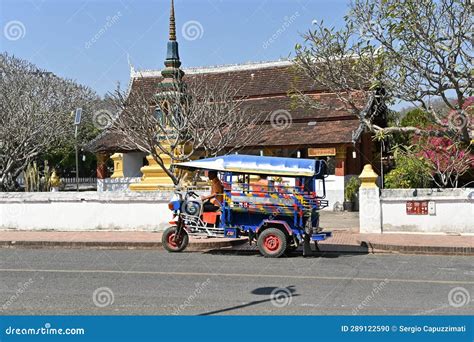 Tuk Tuk Parked On The Street Near A Temple In Luang Prabang Laos