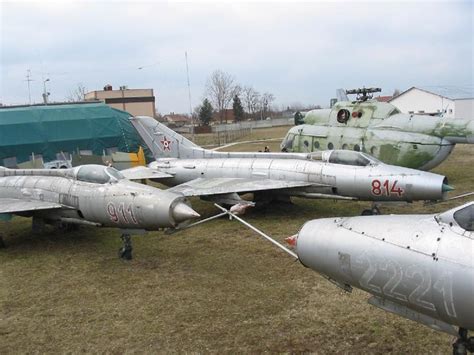 Two Silver Fighter Jets On Grass Field