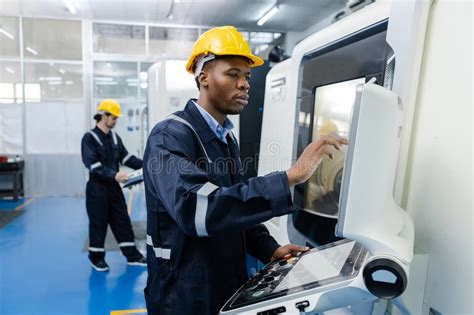 Man African American Engineer Using Computer Controlling Cnc Machine At Workshop Professional