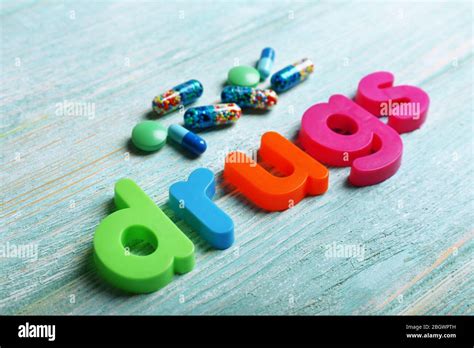 Drugs Word Formed With Colorful Letters On Wooden Background Stock