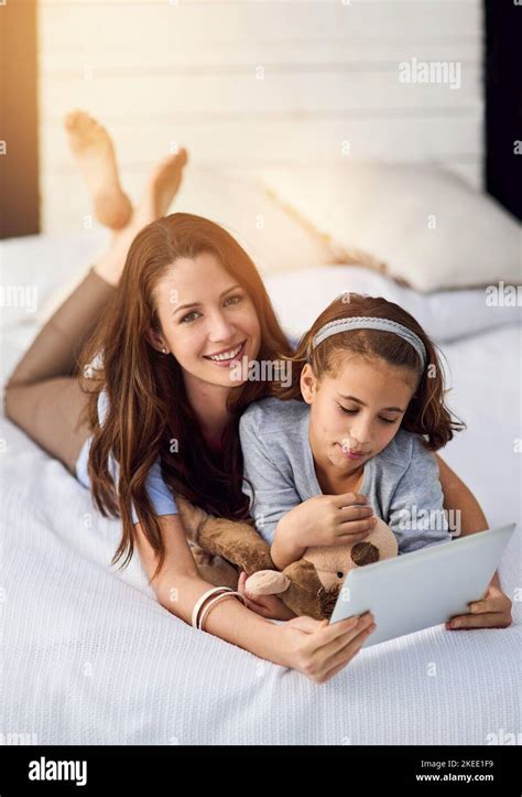 Shes Teaching Me A Few Things Full Length Shot Of A Mother And Her Daughter Using A Digital