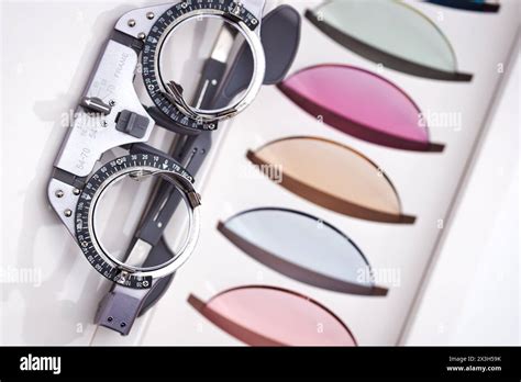 Eye Test Frame For Optician With Many Different Colored Trial Lenses