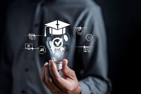 Premium Photo Hand Hold Light Bulb Elearning Program Certificate And