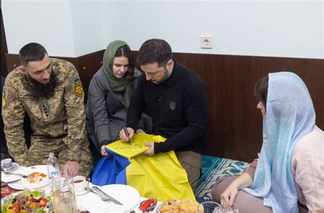 Jewish Ukrainian President Kneeling With Muslim Ukrainians At Iftar Signing Ukrainian Flag