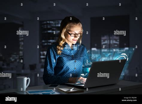 Beautiful Blonde Working On Laptop And Infographs Out Of Screen Mixed