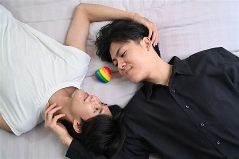 Premium Photo Happy Homosexual Couple Lying Down On Bed Spending Time