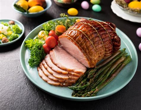 Traditional Easter Dinner With Glazed Ham And Spring Vegetables Stock