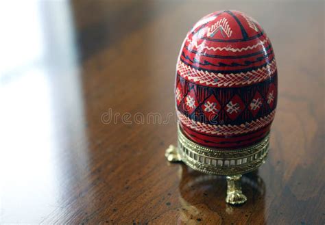 Detailed Red Pysanky Ukrainian Easter Egg On A Wooden Table Stock Image
