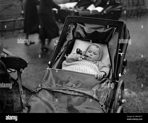 Just Teething But Gillian Prefers Father S Pipe Gillian Quennell Bites Happily At Her
