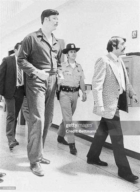 Edmund Kemper Iii Towering Above Police Officers Is Escorted Into